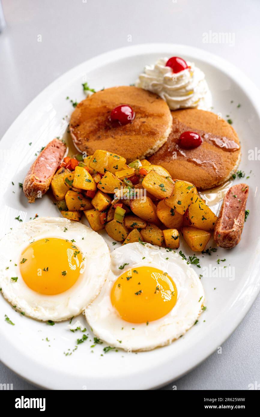 An appetizing and diverse Dominican-American breakfast plate consisting ...