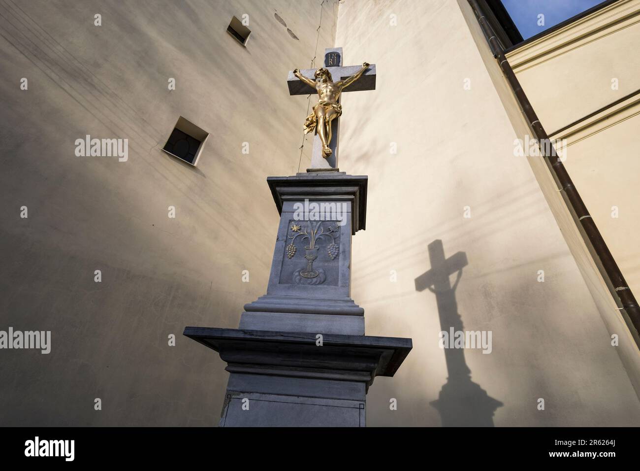 Pedestal with christian cross and crucified Jesus Christ. Christianity ...
