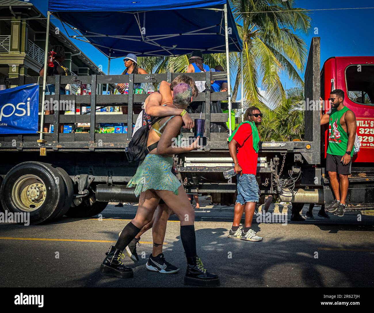 Grand Cayman, Cayman Islands, May 2023, view of a couple walking with ...