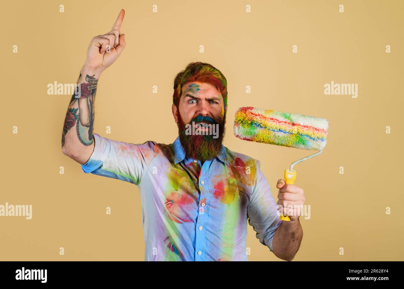 Professional painter, decorator, builder worker with paint roller ...