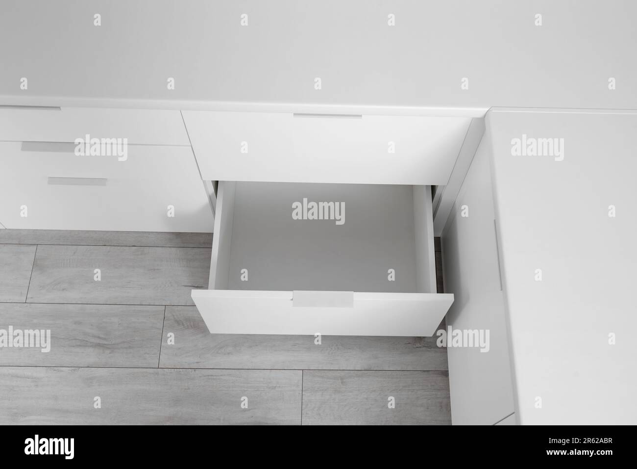 White counter with open drawers in light kitchen Stock Photo - Alamy