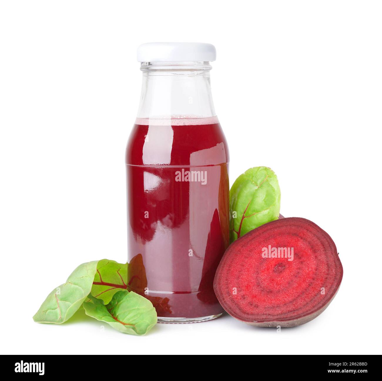 Bottle of healthy beet juice and spinach on white background Stock ...
