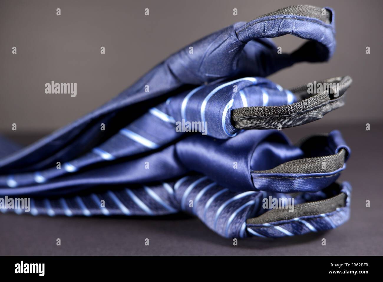 This stock photo features two ties; one is tied in a knot around a ...