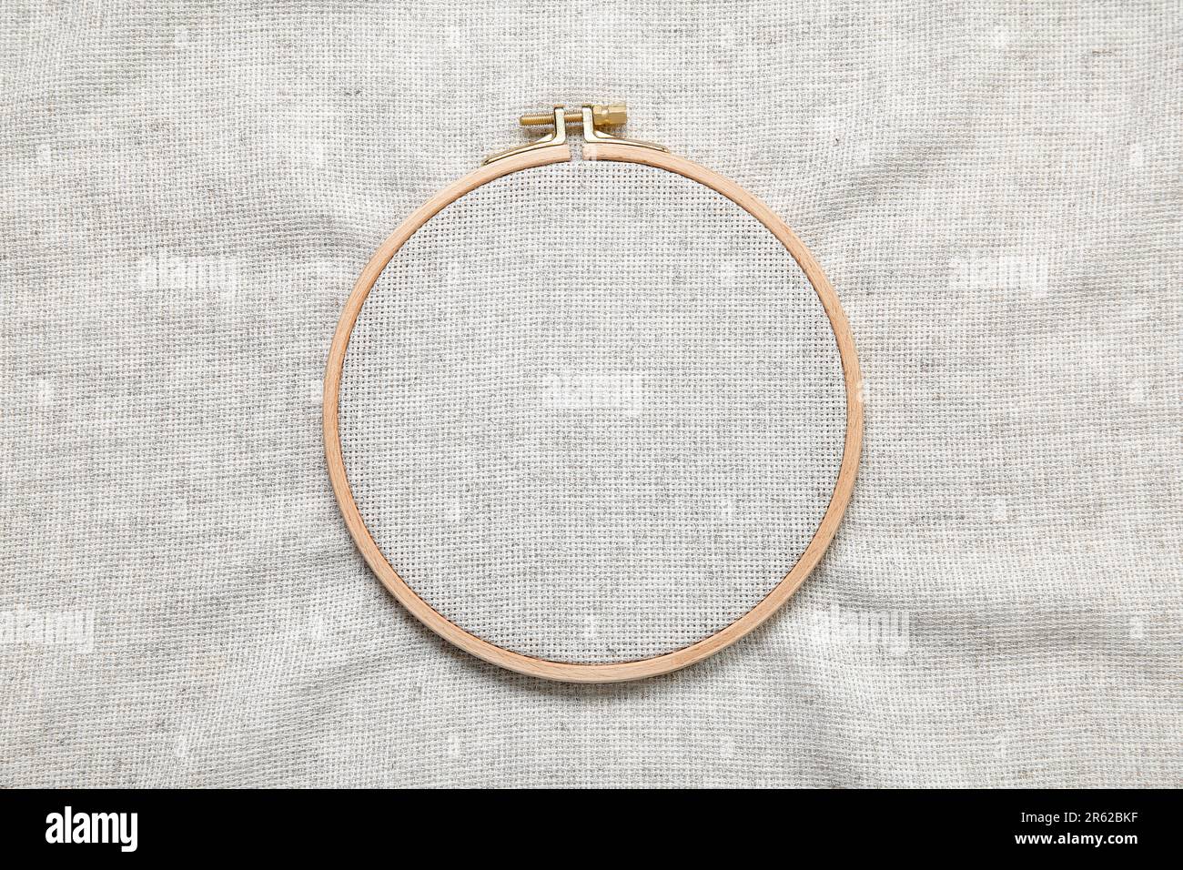 Wooden embroidery hoop with canvas as background Stock Photo - Alamy