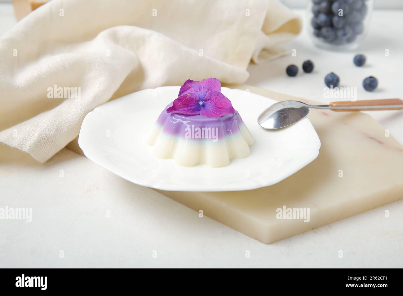 Plate of panna cotta with beautiful hydrangea flower and blueberry on ...