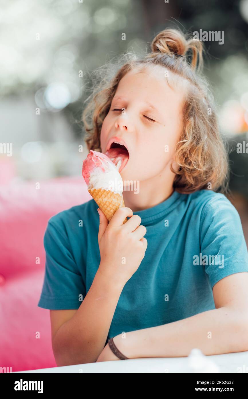 Portrait of boy eating cone ice cream. Child licking ice cream Stock ...