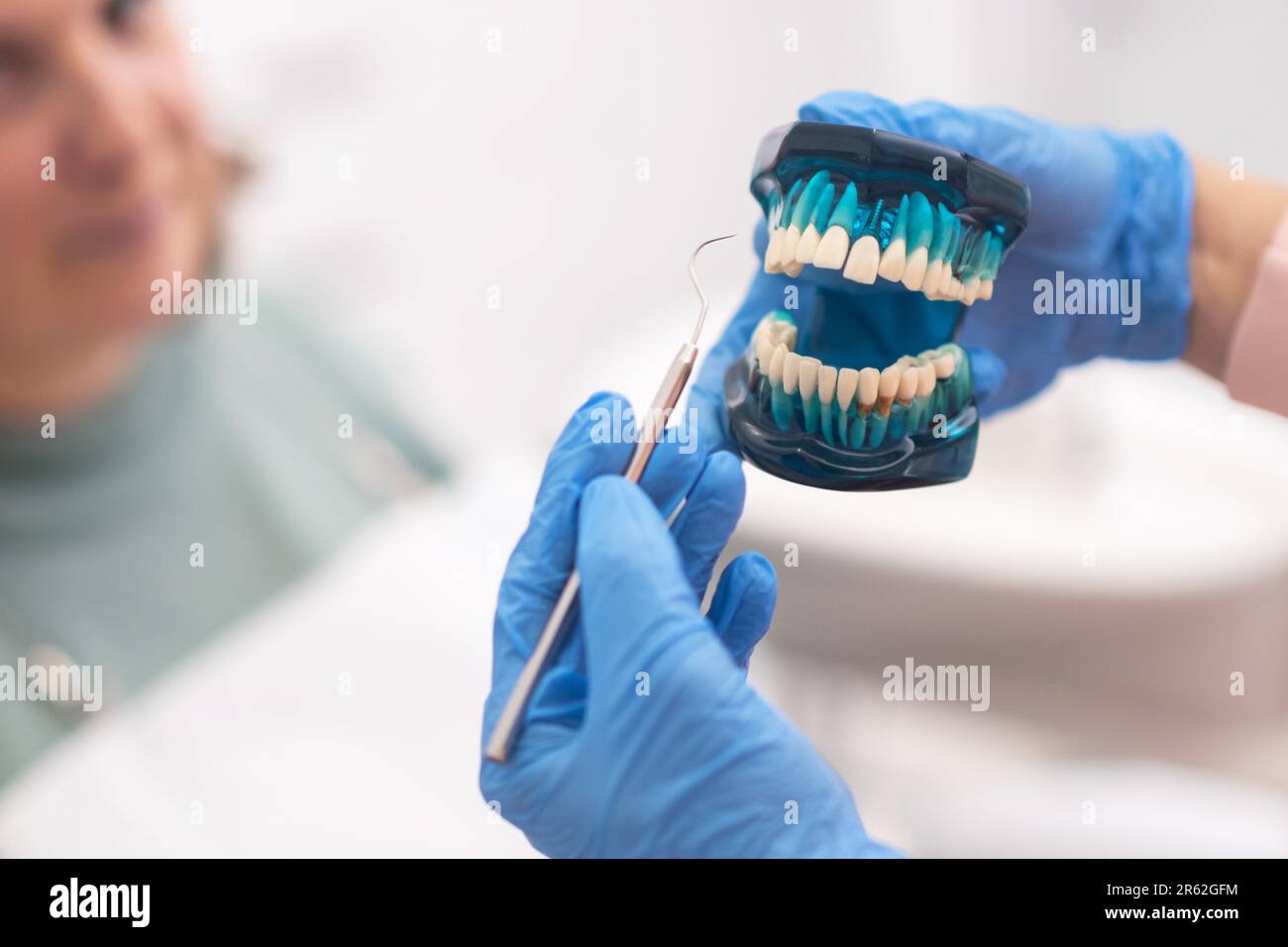 Woman patient listening to dentist explaining a treatment plan and ...