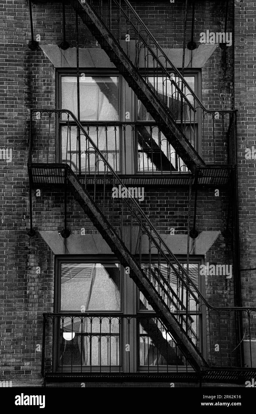 An architectural black and white photograph of a metal fire escape ...