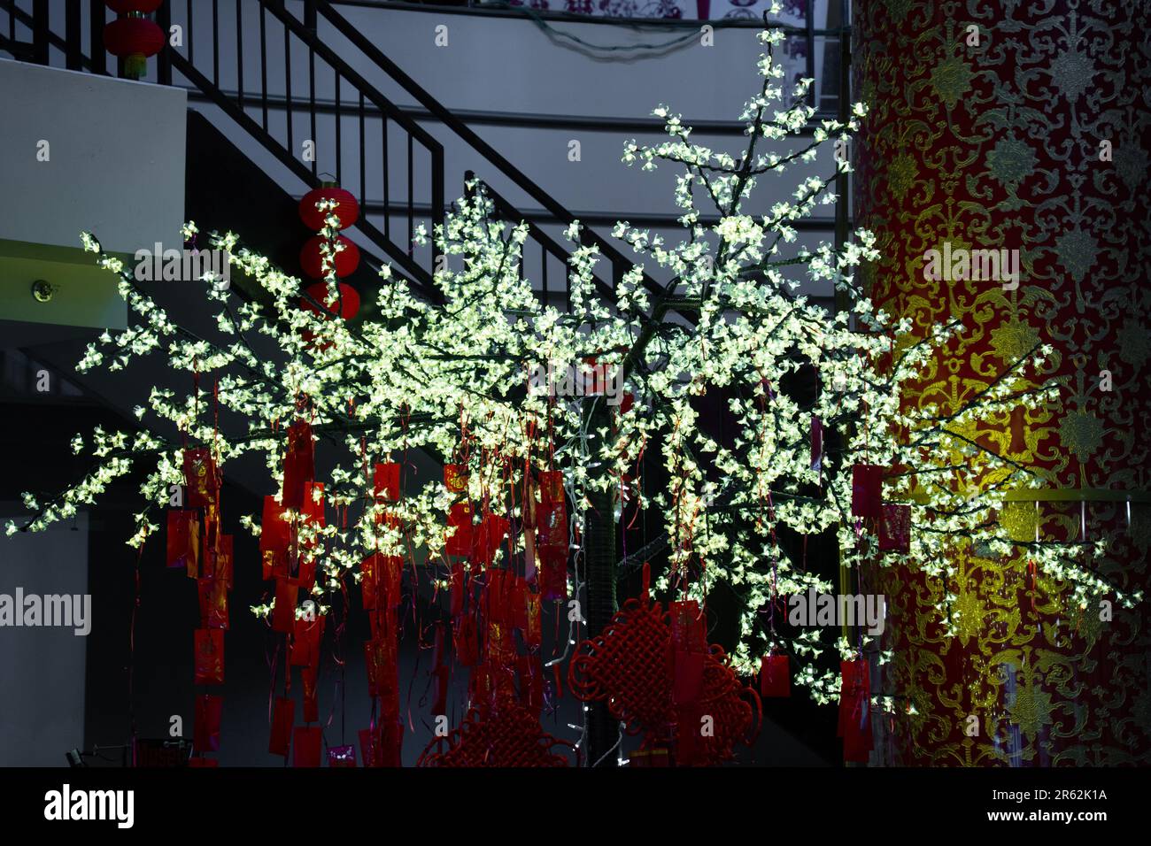 A brightly lit decorative tree illuminated with colorful lights ...