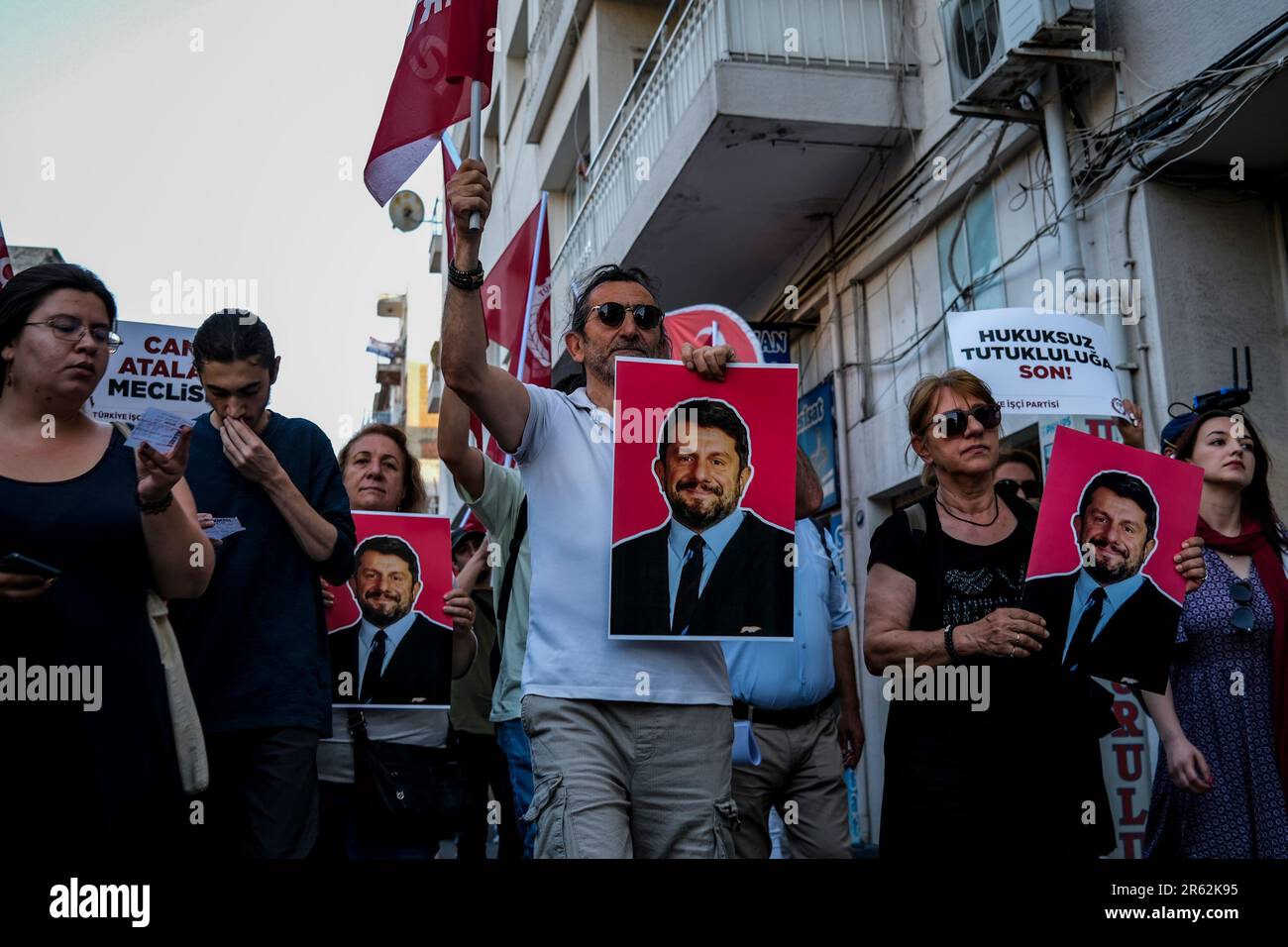 Izmir, Turkey. 06th June, 2023. Activists hold pictures of Can Atalay ...