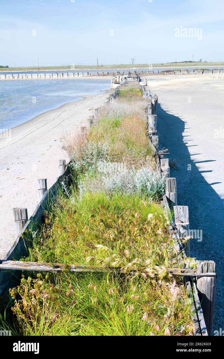 An ancient abandoned salt factory, saltworks. The remains of wooden ...