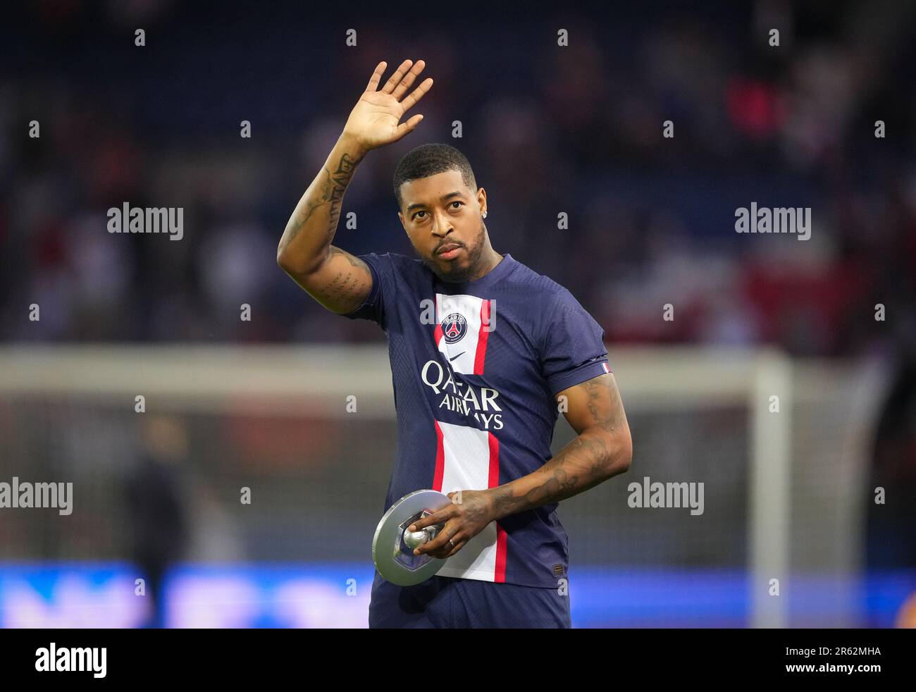 Presnel Kimpembe of PSG with a league winners trophy following ...