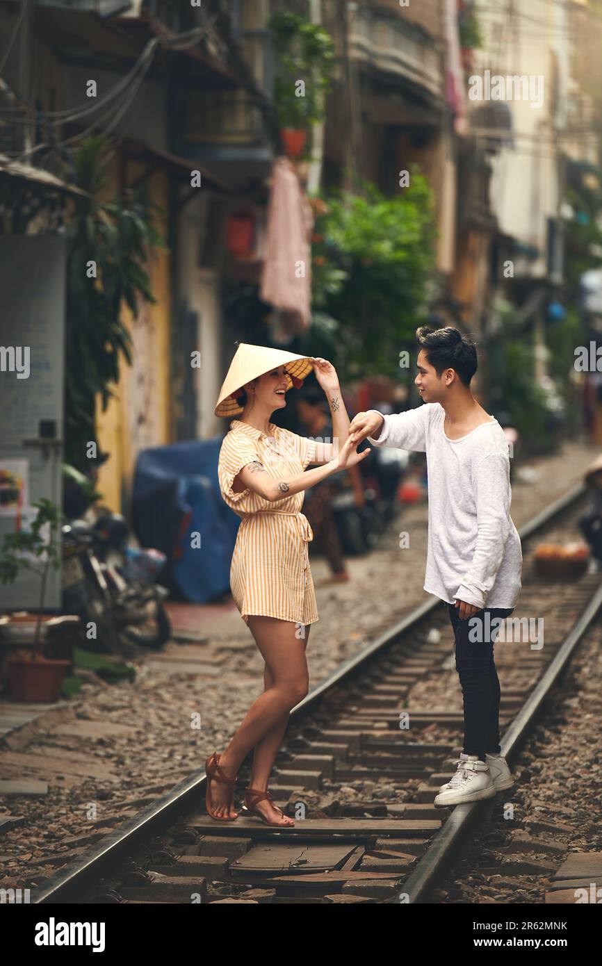 My lady, may I have this dance. a young couple dancing on the train ...