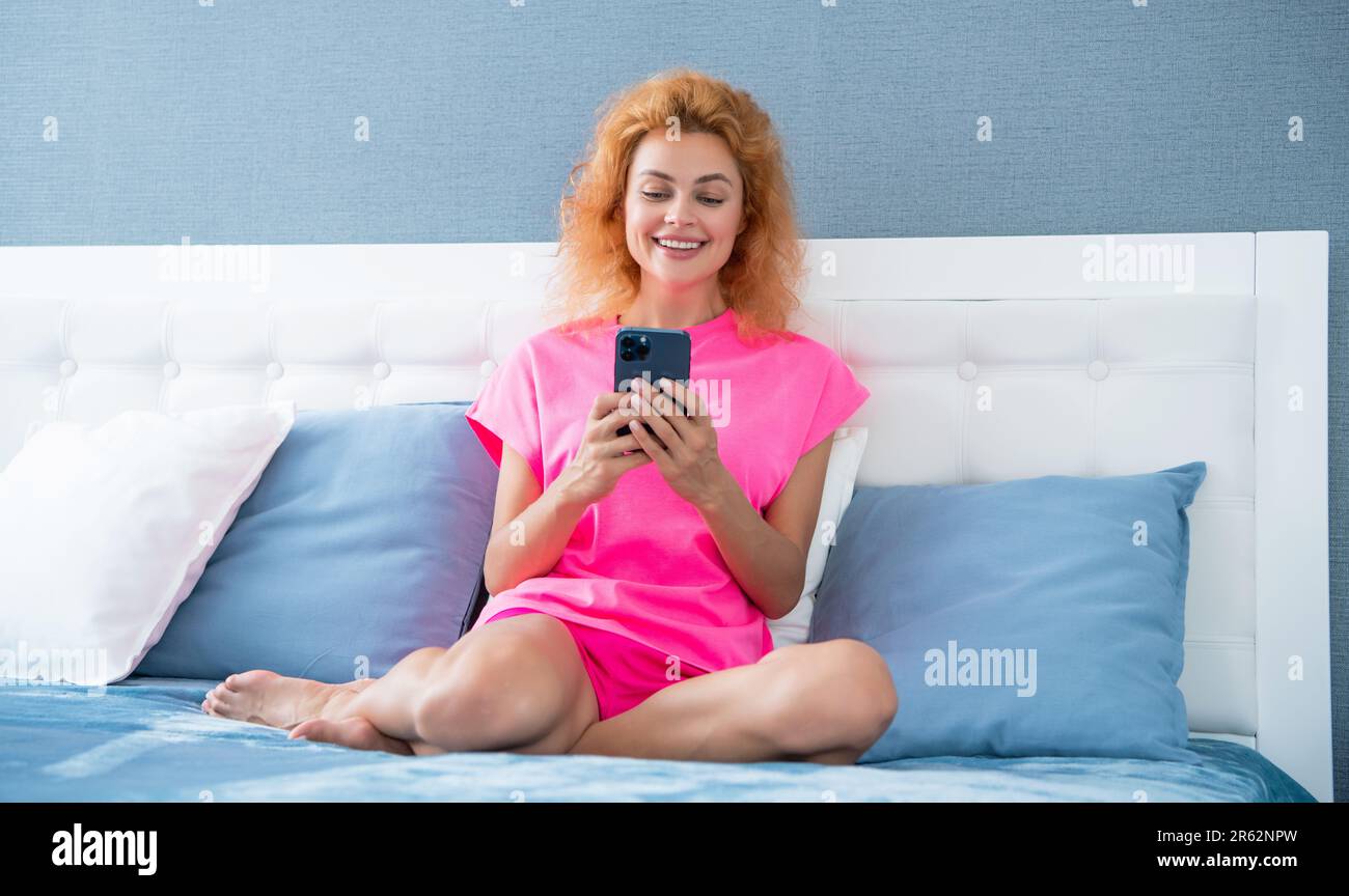 happy girl at home has communication on phone. girl using phone ...