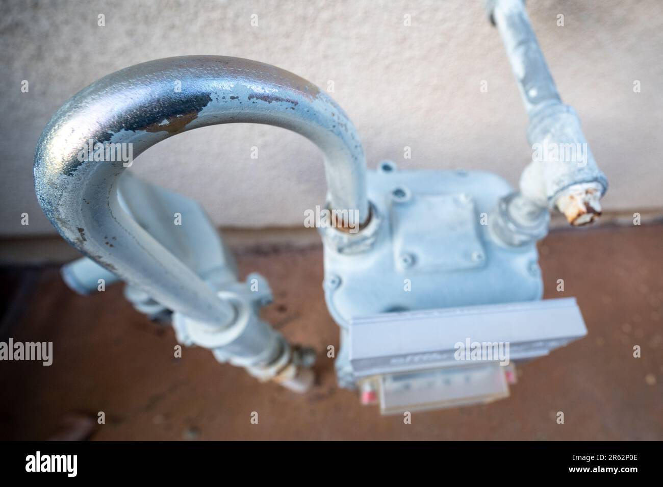 A high resolution closeup shot of a stainless steel pipe, with a glossy ...