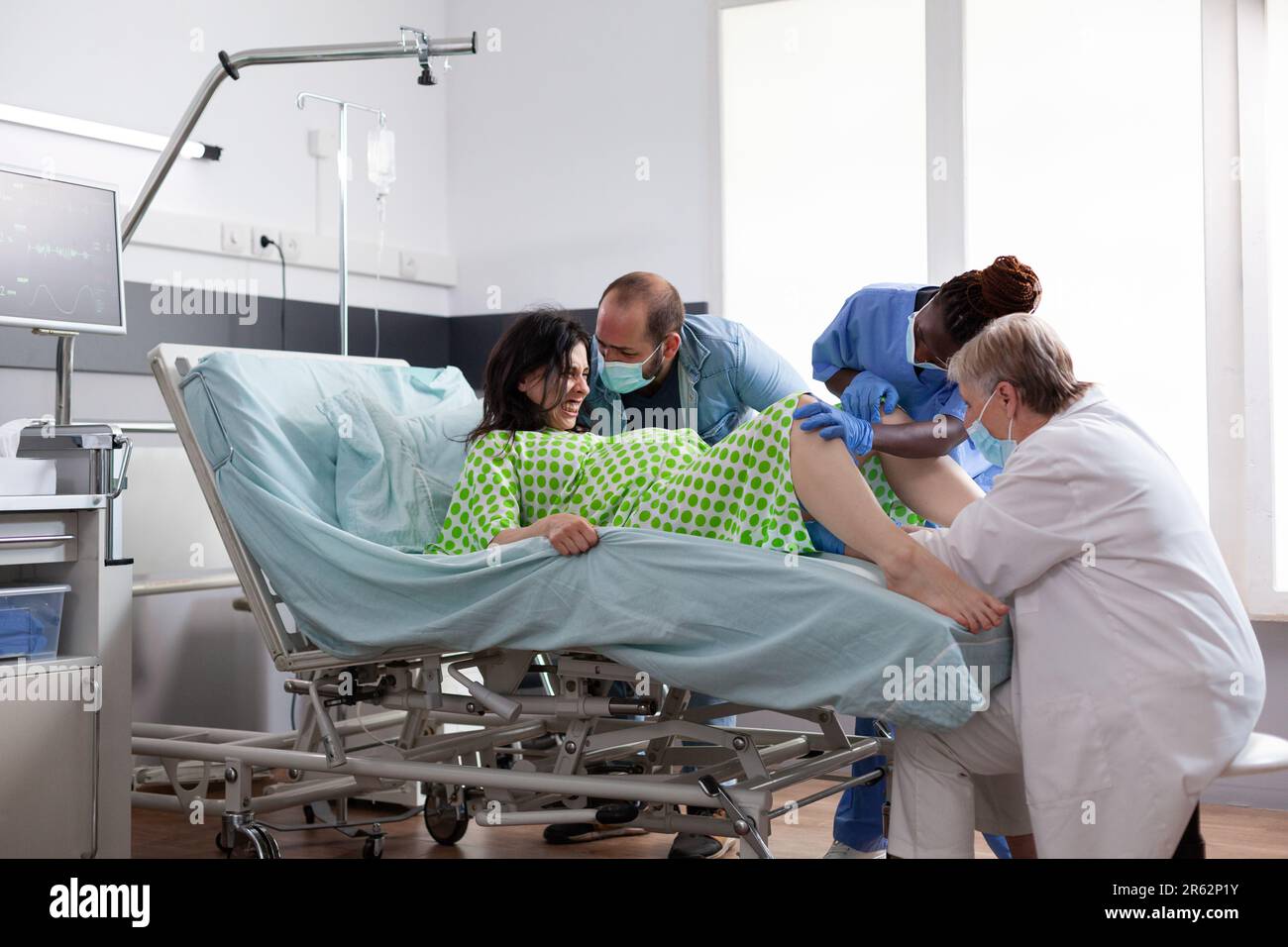 Future mother giving birth to child in hospital ward, screaming and ...