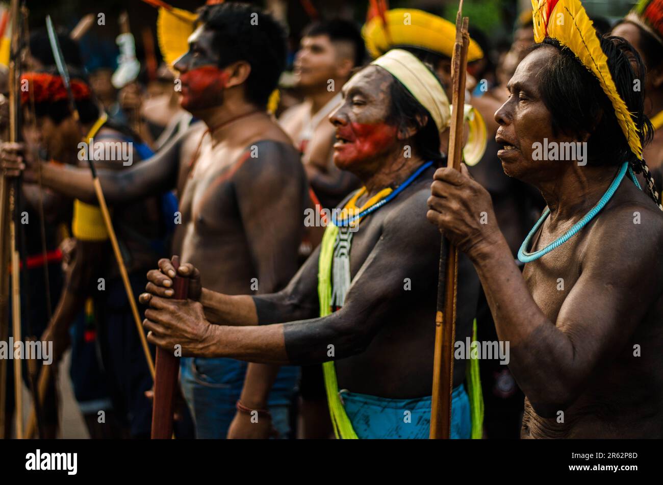 Indigenous protesters sing and dance during the demonstration. Between ...