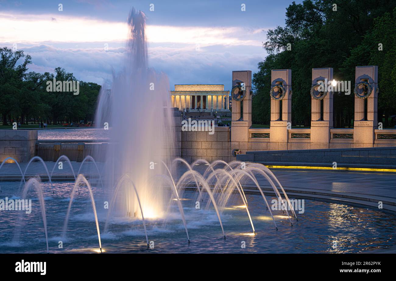 The World War II memorial fountains cascade peacefully as they reflect ...