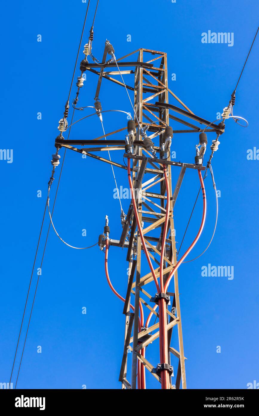 Transmission tower with deep blue sky background Stock Photo - Alamy