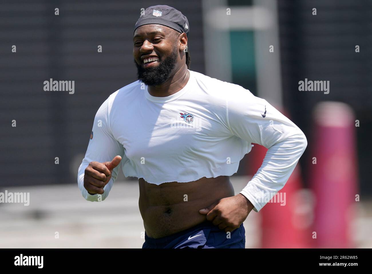 Tennessee Titans defensive lineman Denico Autry runs across the field ...