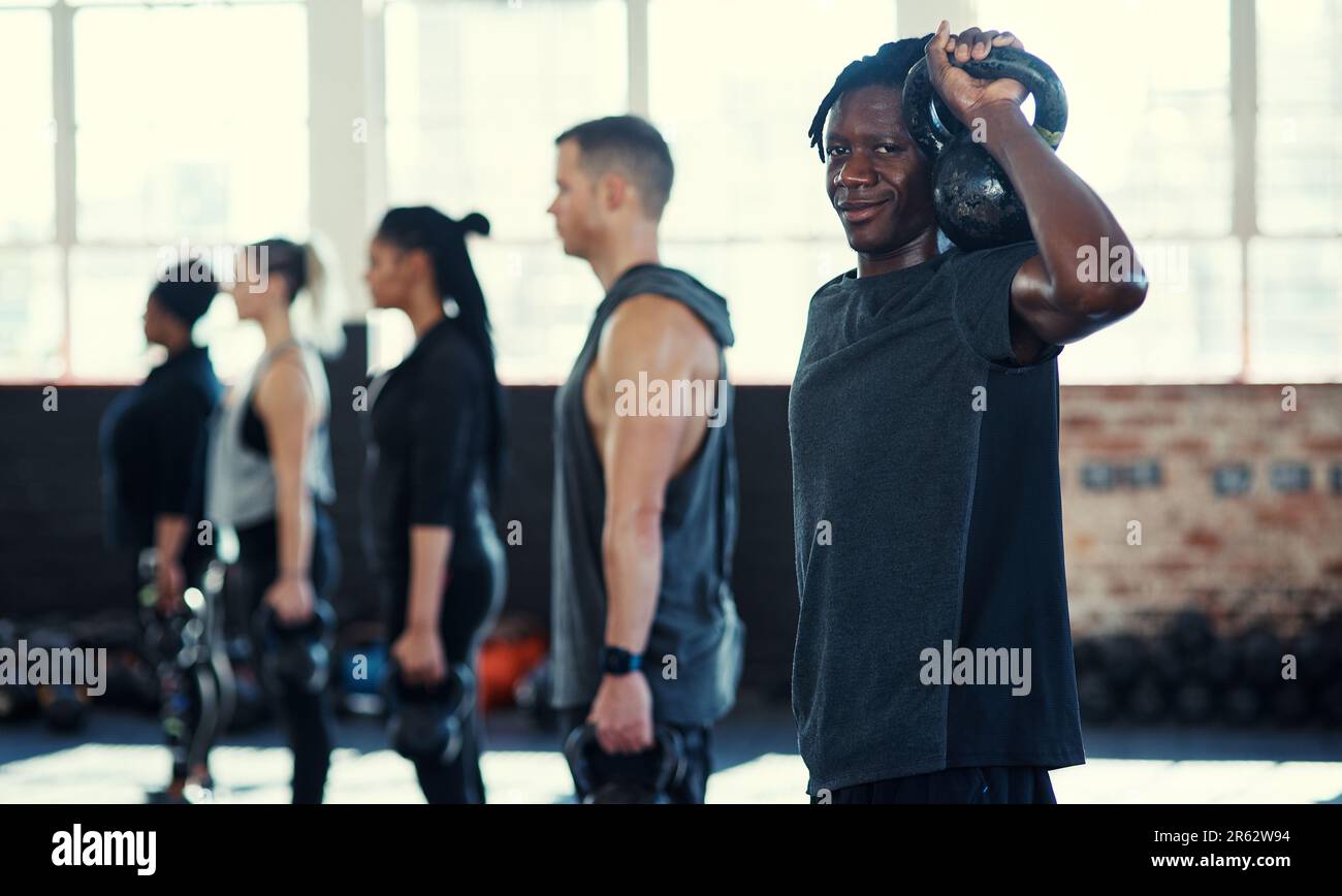 All about that fitness. a focused group of young people standing in a ...