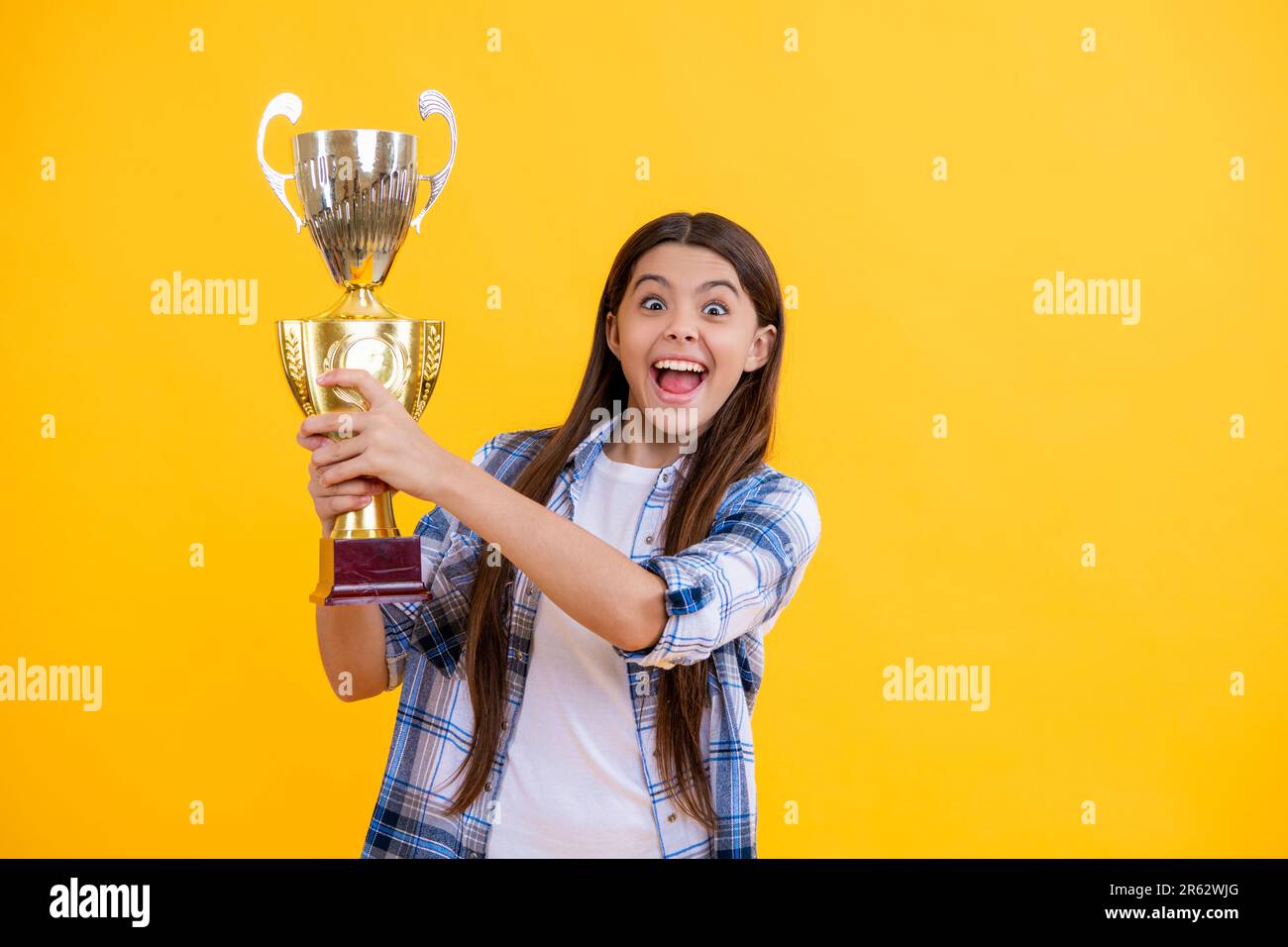glad teen girl accept award on background. proud teen girl with ...