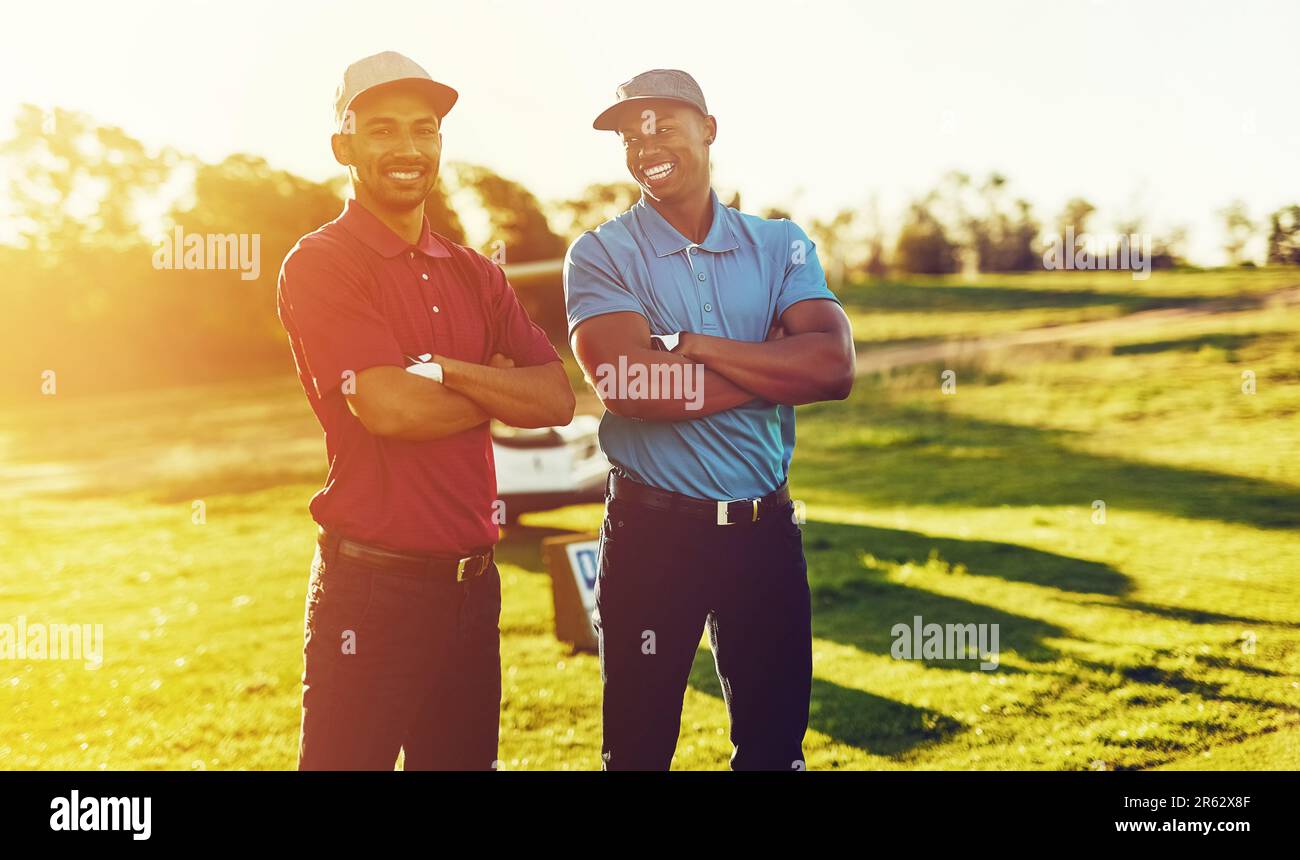 We get our daily dose of iron. two friends standing together on a golf ...