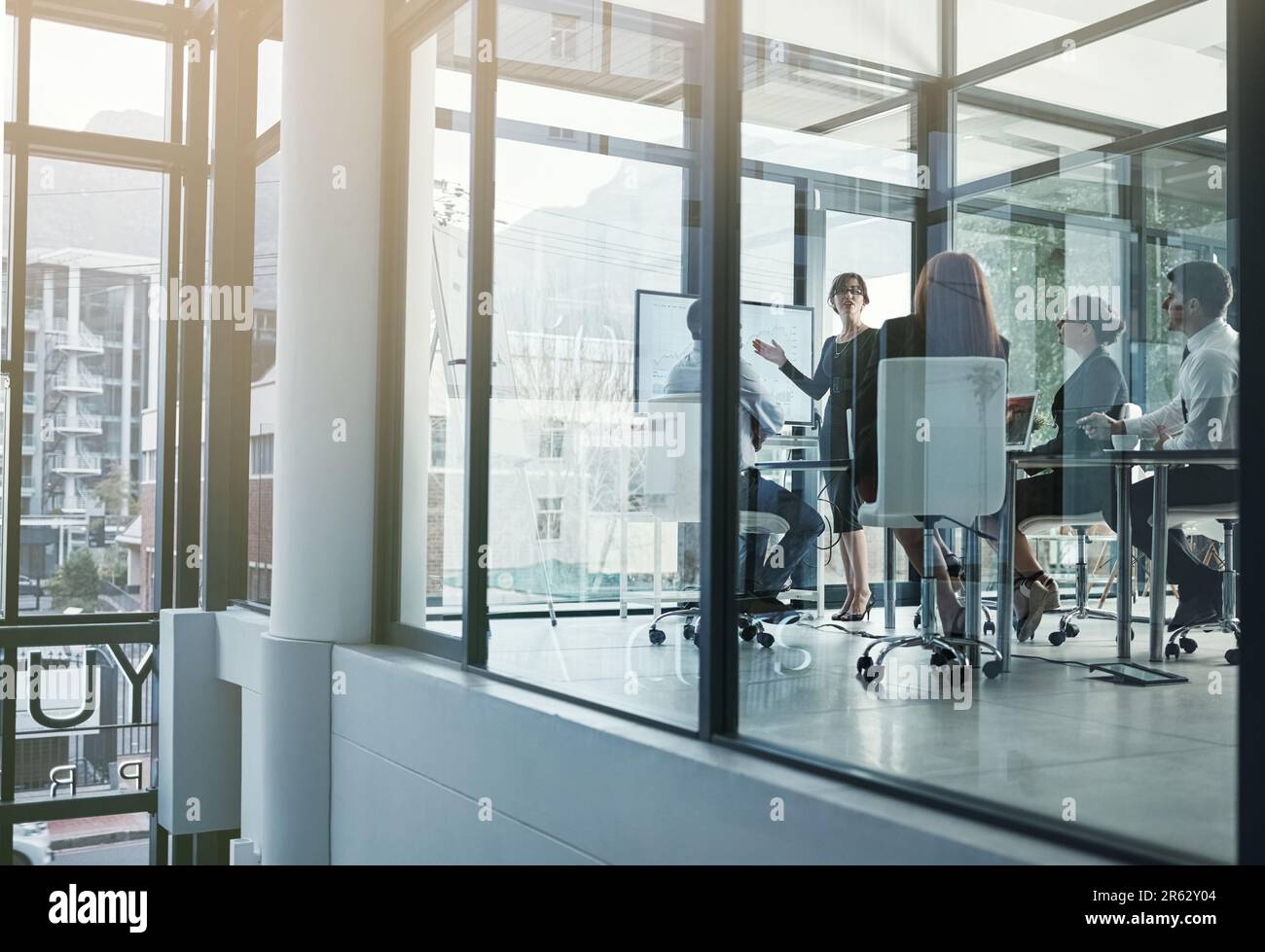 Success begins in the boardroom. an executive giving a presentation on ...