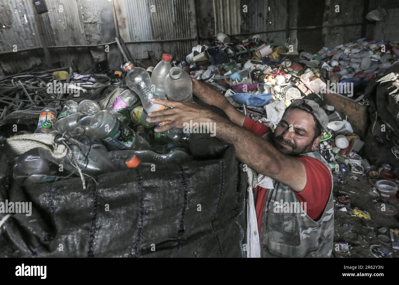 Gaza, Palestine. 06th June, 2023. A Palestinian worker picks up plastic ...