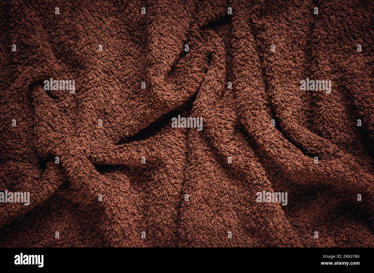 Furry wrinkled blanket texture. Close-up of brown material, may be used ...