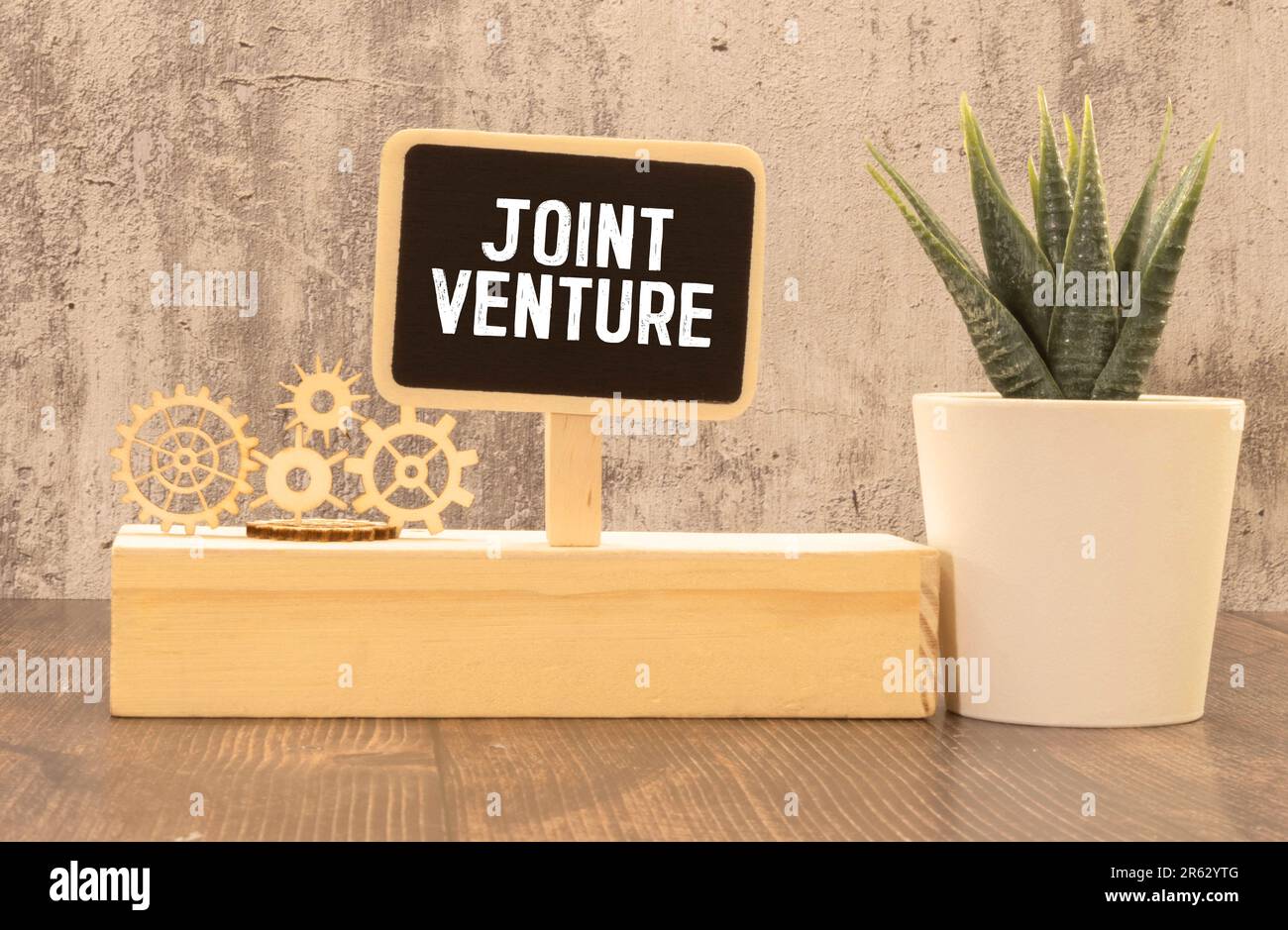 Black color banner that have embossed letter with word venture on white ...