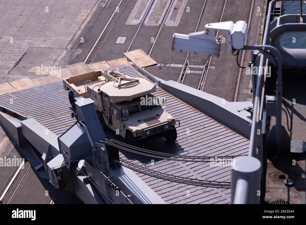 The 833rd transportation battalion loads military equipment onto the ...