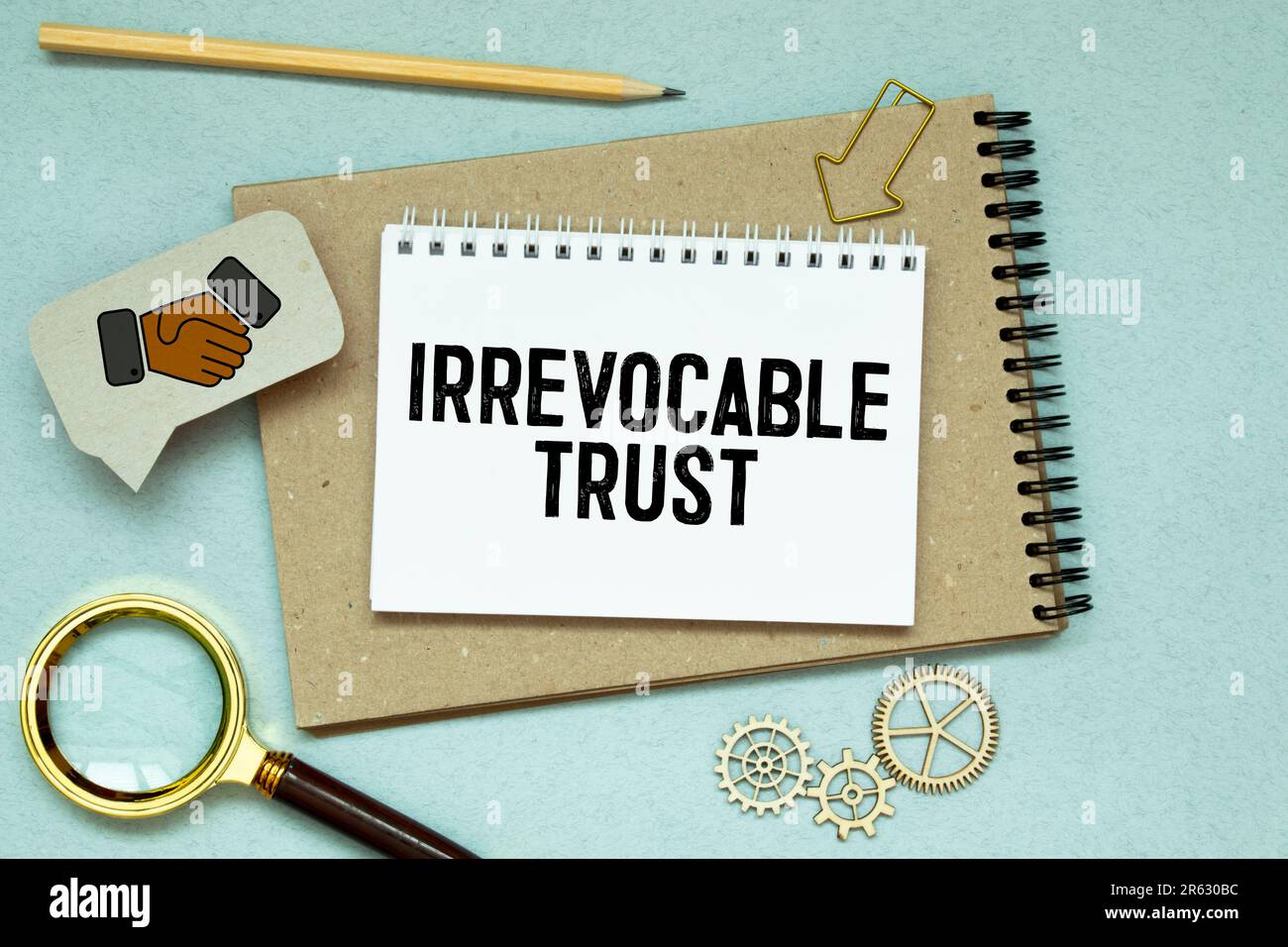 Irrevocable trust text on white sticker and pen Stock Photo - Alamy