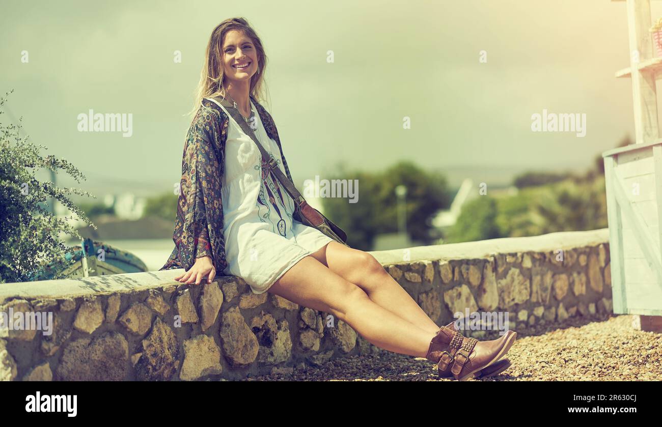 Sunny days are here again. a free spirited young woman enjoying the ...