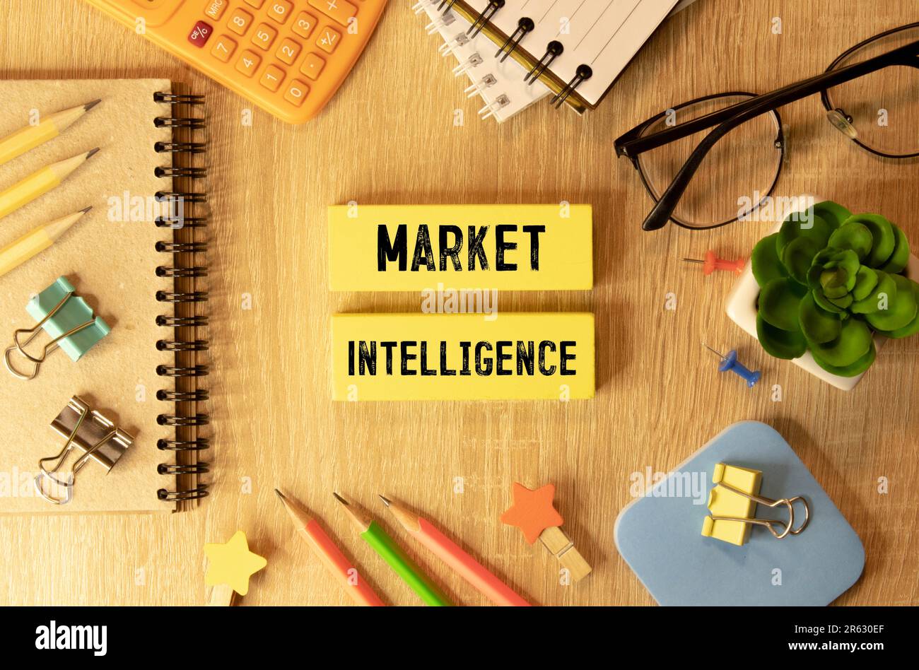 Text MARKET INTELLIGENCE on a Office desk table with keyboard, notepad ...