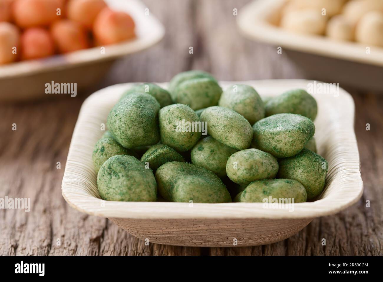 Green Japanese-style crunchy coated peanuts or cracker nuts flavored ...