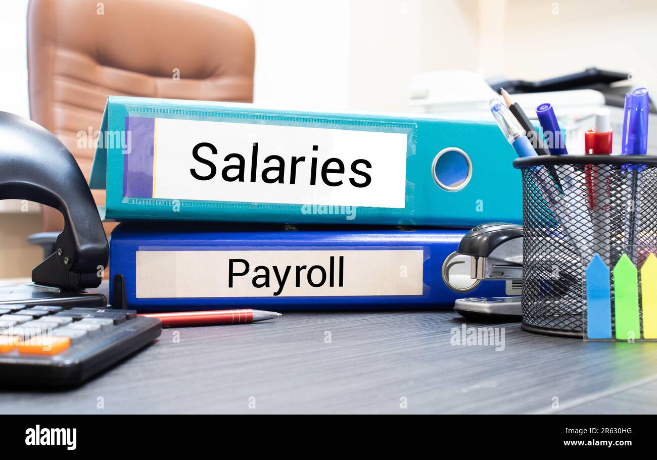 On a light background, a black pen and a brown notebook on black ...