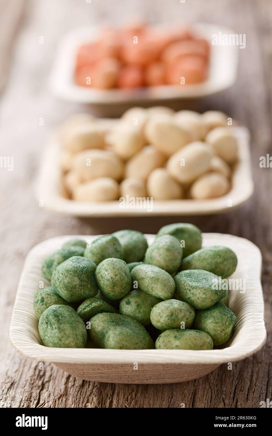 Green Japanese-style crunchy coated peanuts or cracker nuts flavored ...