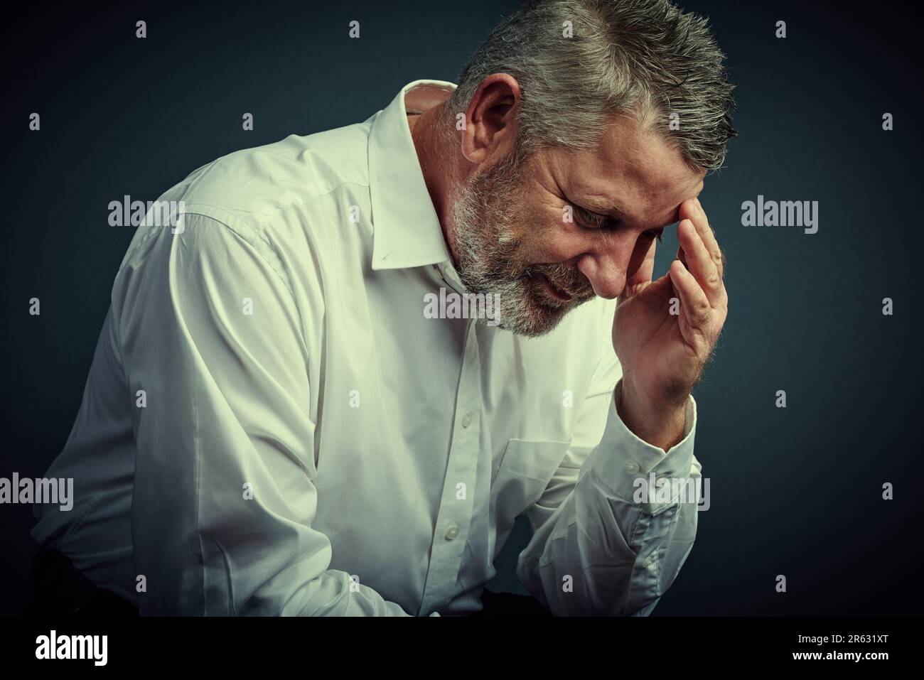 The stress is mounting. Studio shot of a mature businessman looking ...