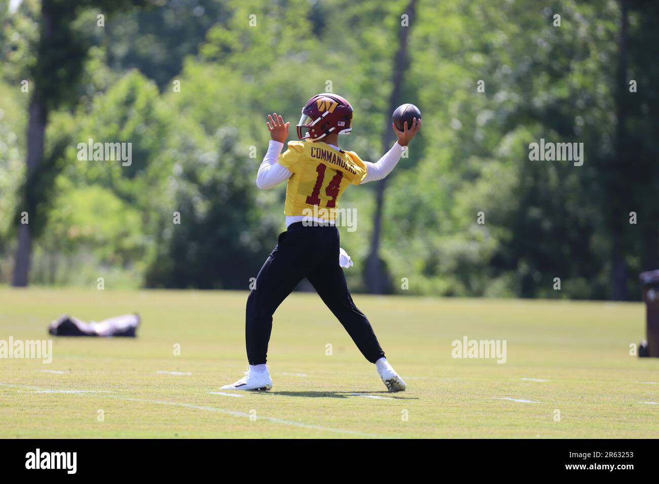 Washington Commanders quarterback Sam Howell (14) warming up, throwing ...
