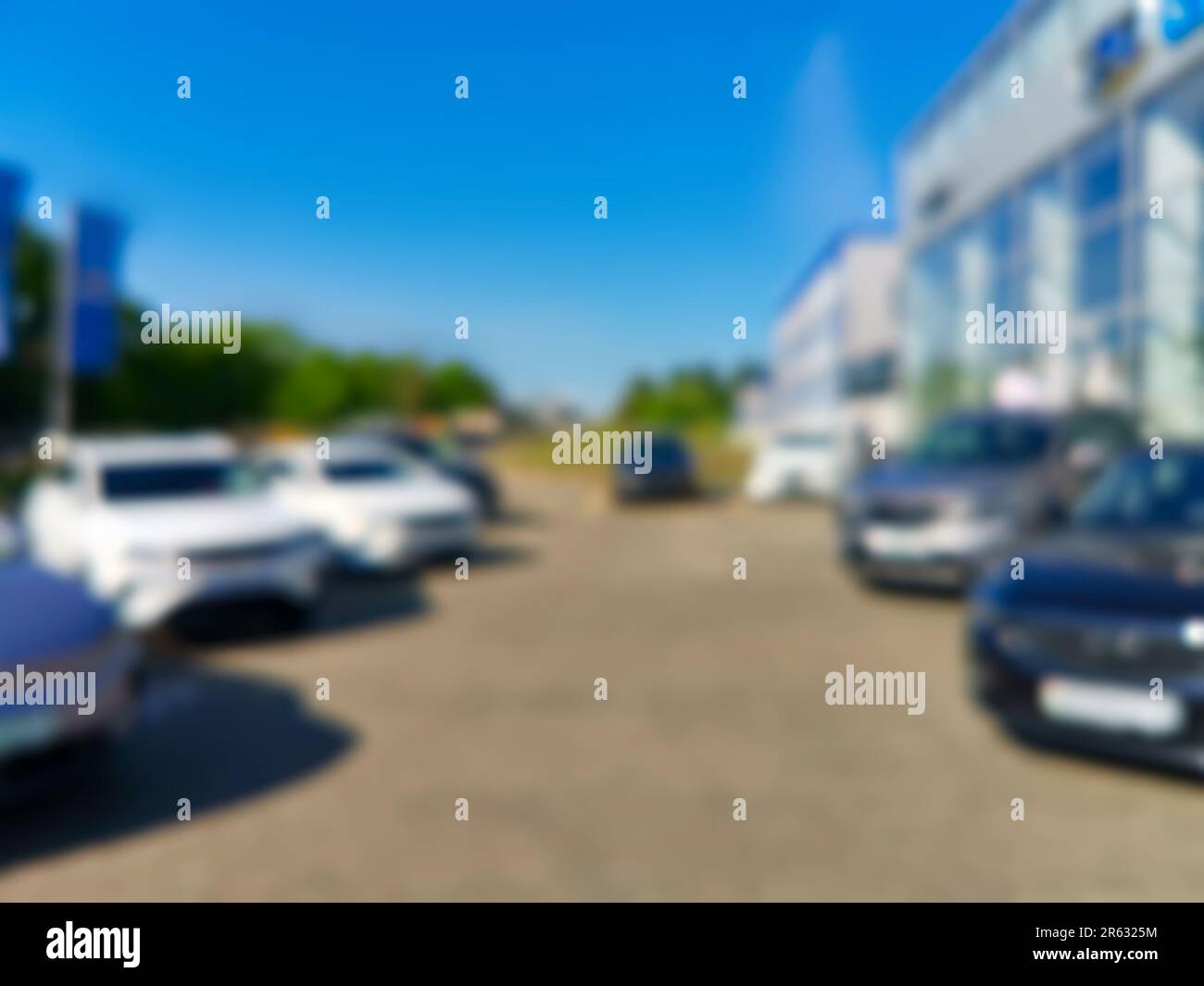 Abstract blurred outside of car dealership. Cars for a test drive ...