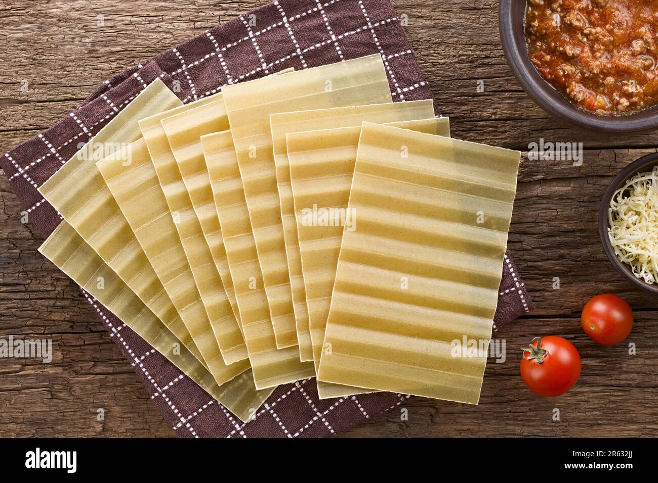 Dry uncooked ridged lasagna pasta sheets, photographed overhead on ...