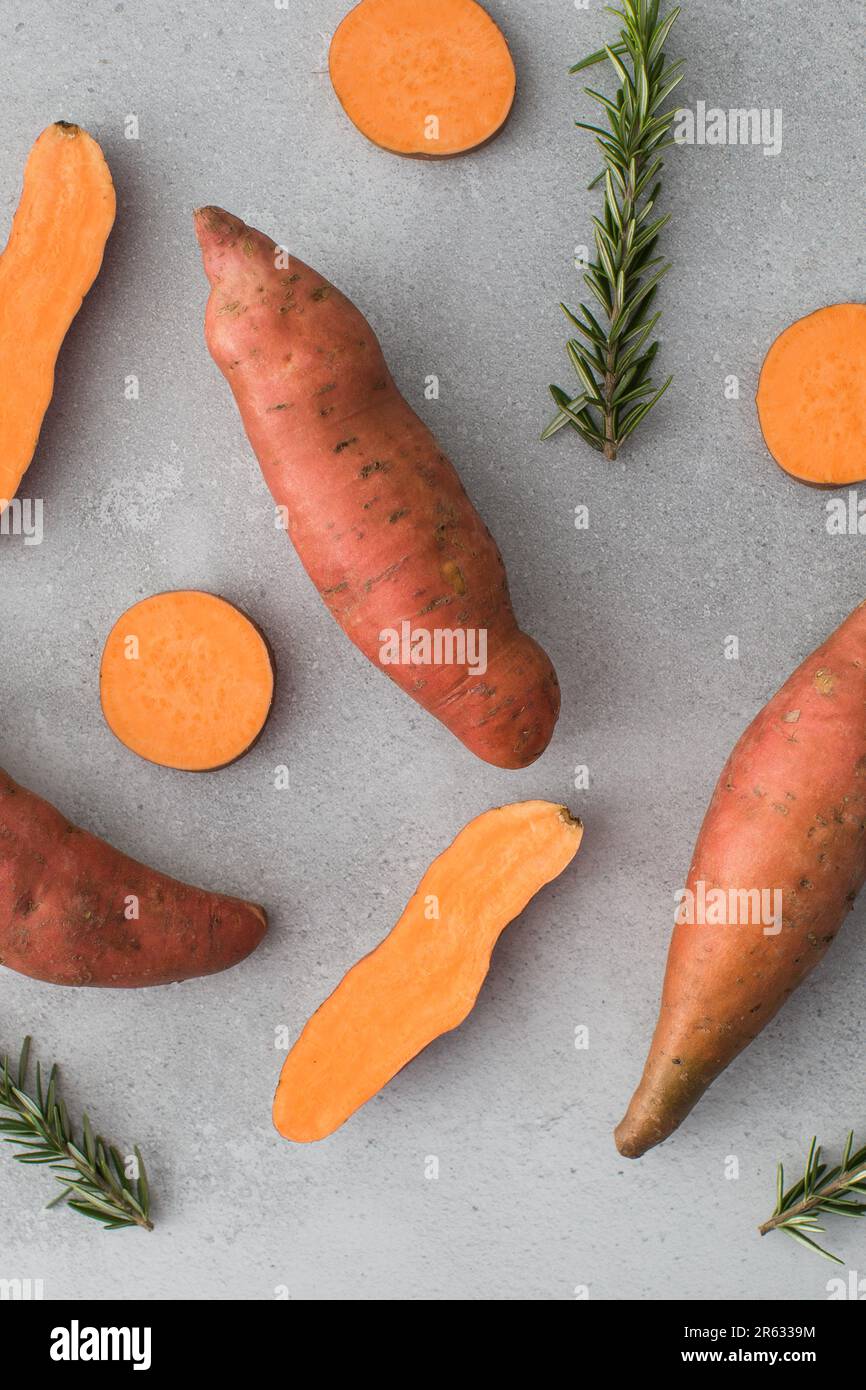 Raw sweet potatoes whole and cut. Orange kumara, sweet potato ...