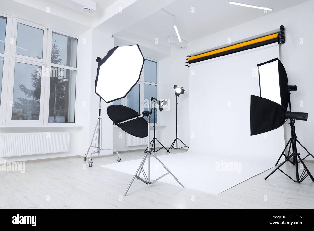 Interior of modern photo studio with professional lighting equipment ...