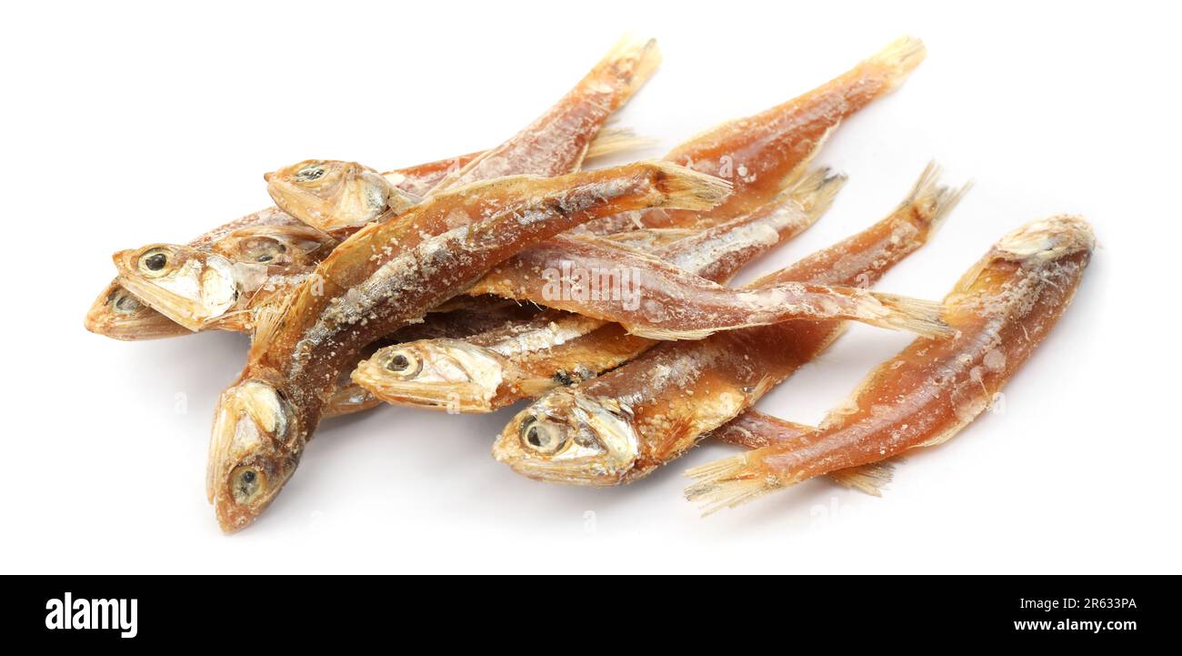 Delicious dried salted anchovies on white background Stock Photo - Alamy