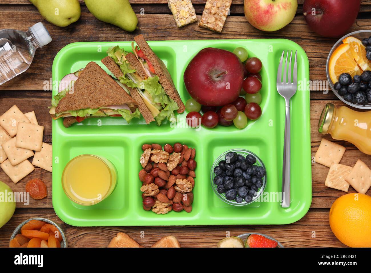 Flat lay composition with serving tray, tasty healthy food on wooden ...