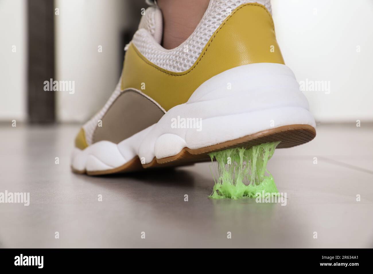 Person stepping into chewing gum on floor, closeup Stock Photo - Alamy