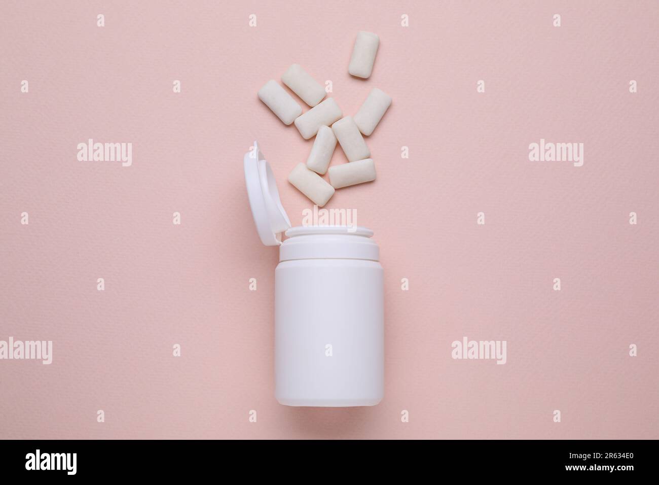 Jar with chewing gums on light pink background, flat lay Stock Photo ...