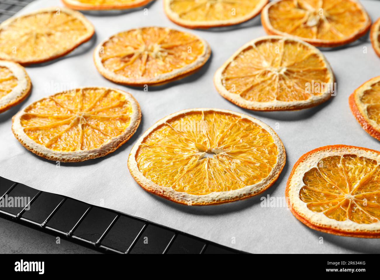 Dry orange slices on parchment paper, closeup Stock Photo - Alamy