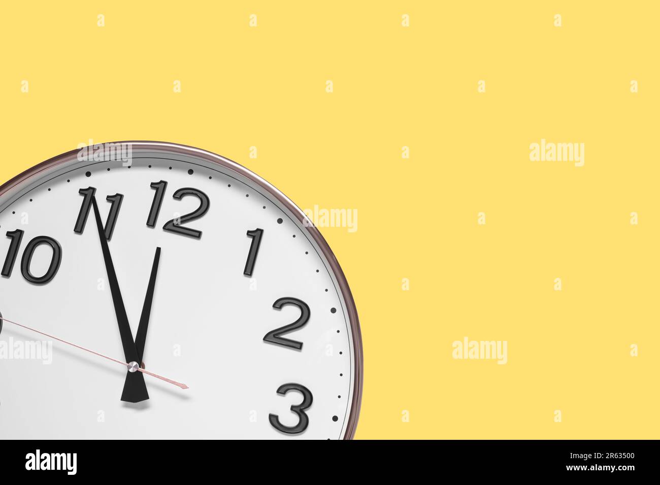 Clock showing five minutes until midnight on yellow background, top ...